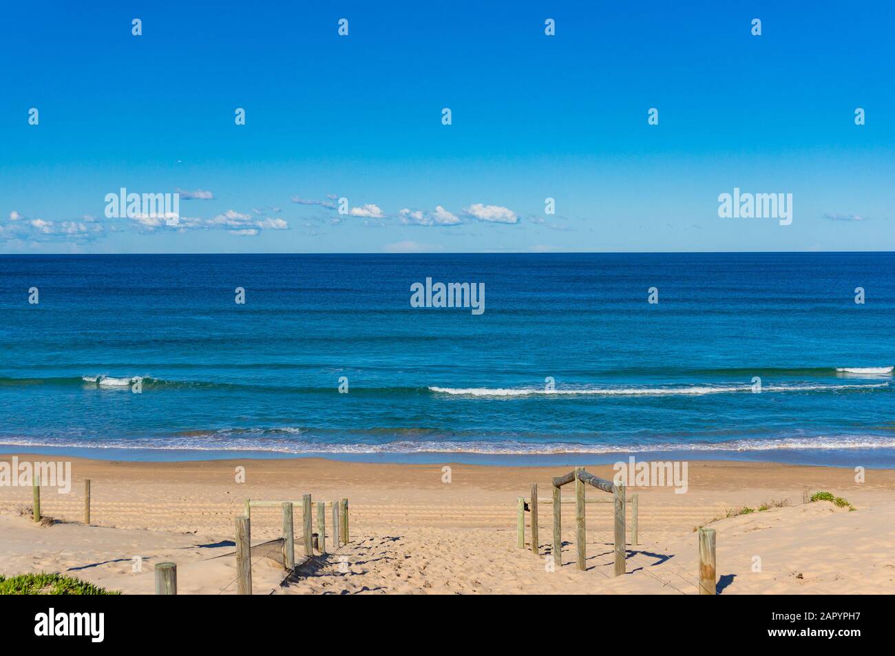 Beach entrance with wooden railings and calm sea view Stock Photo - Alamy