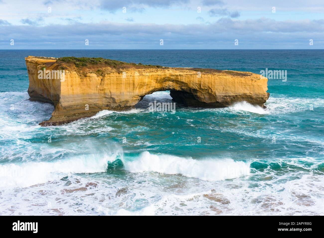 Rock with arch in the ocean. London Bridge natural landmark along Great ...