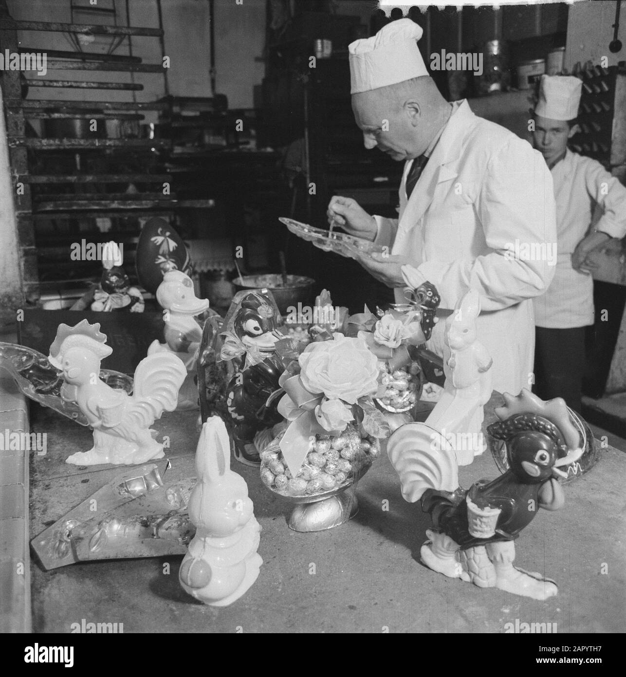 Easter print at the confectioner. Baker in action with the delights ...