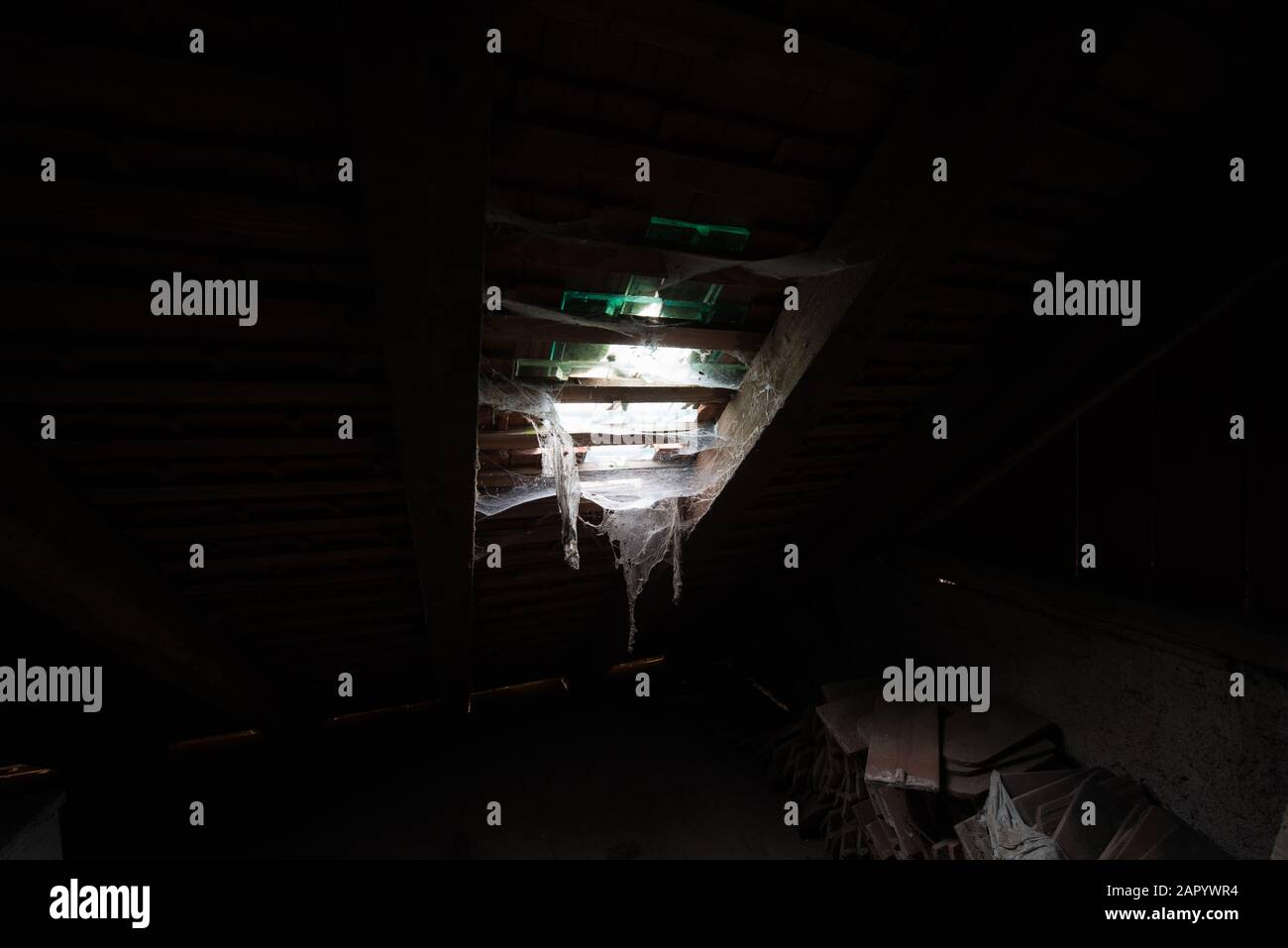 Inside the attic of an old house with cobwebs Stock Photo - Alamy