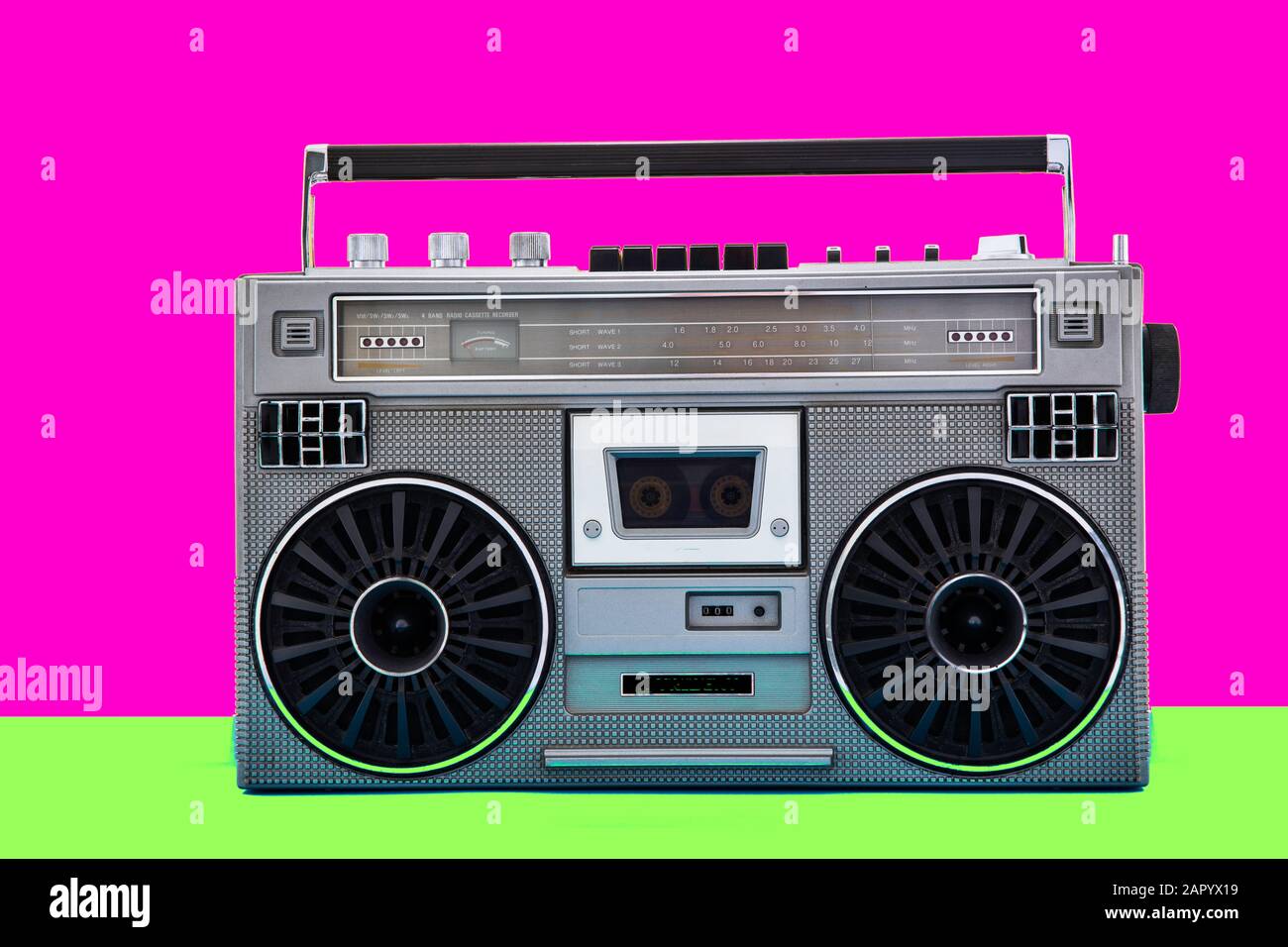 1980s Silver retro radio boom box on color background Stock Photo - Alamy