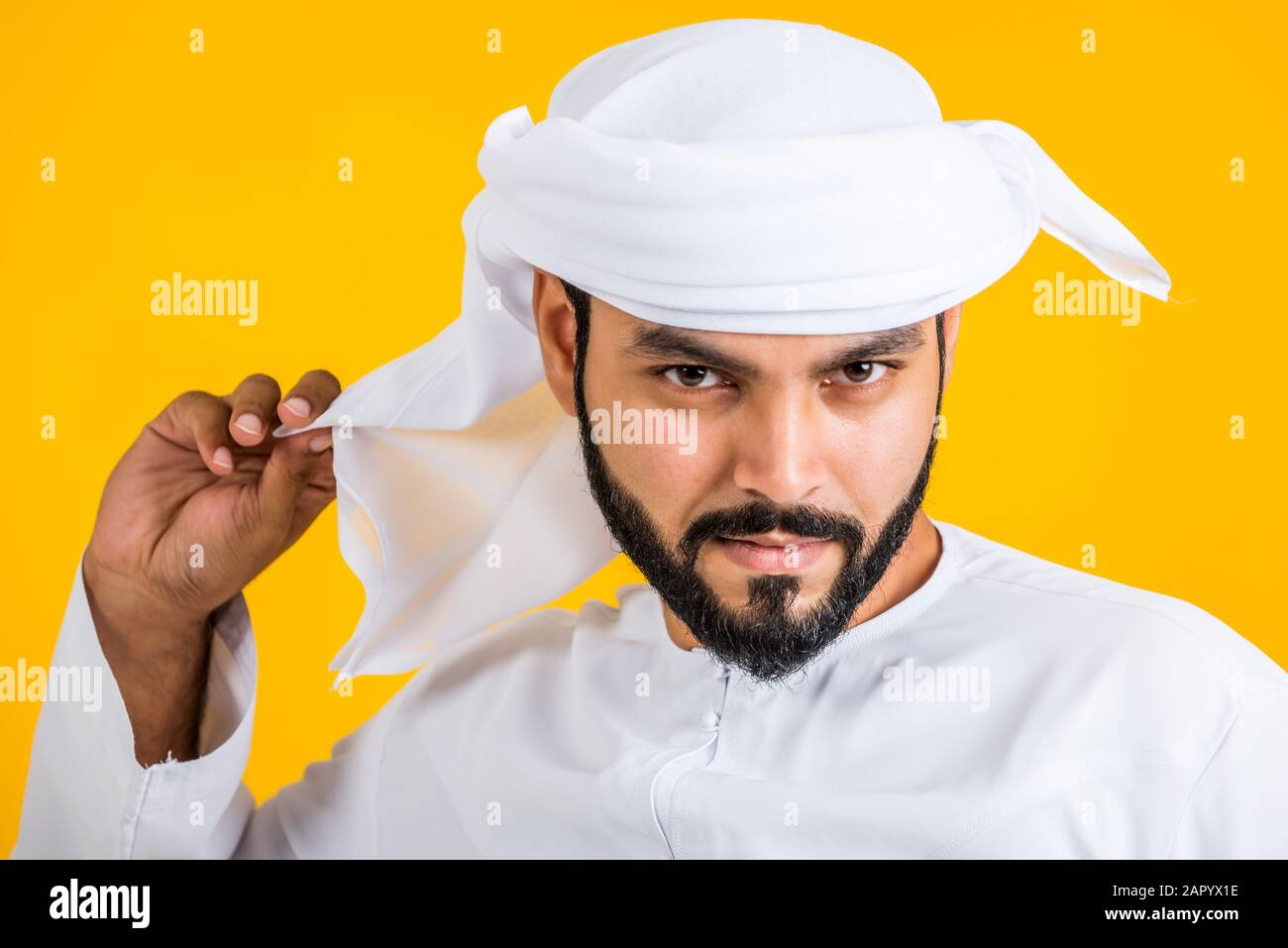 Middle eastern man with traditional emirates dresses posing in a ...