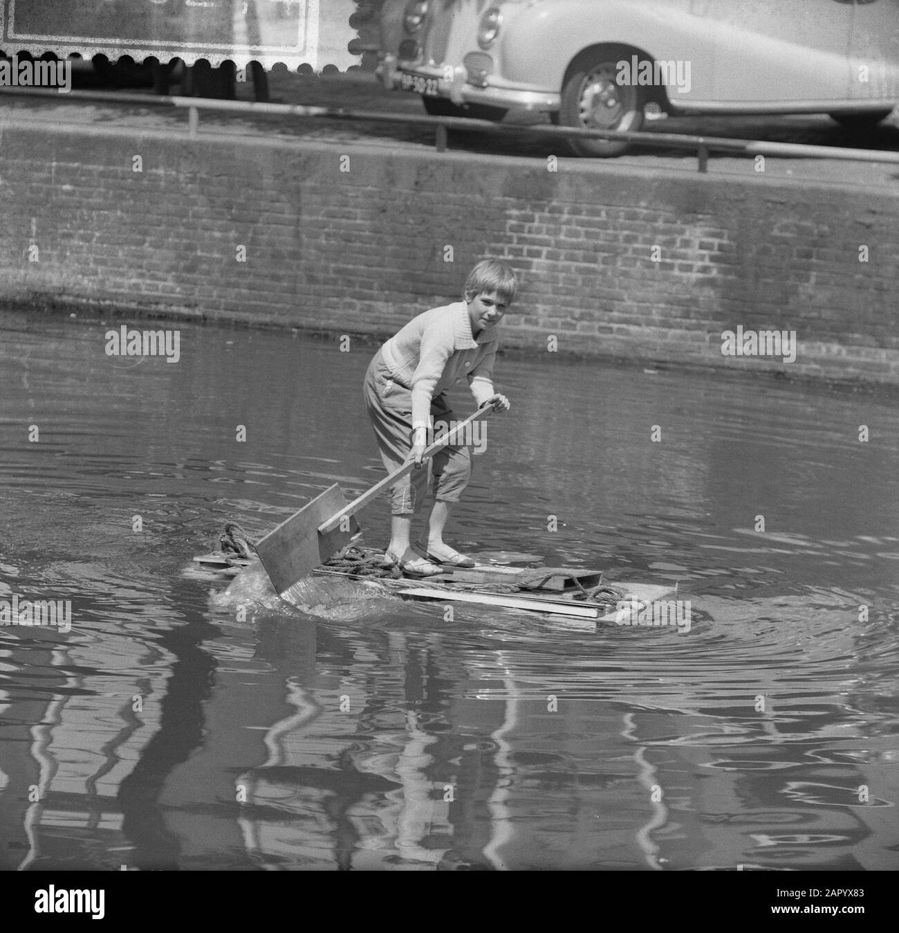 Girl on self-built raft Date: June 21, 1961 Keywords: canals, girls ...
