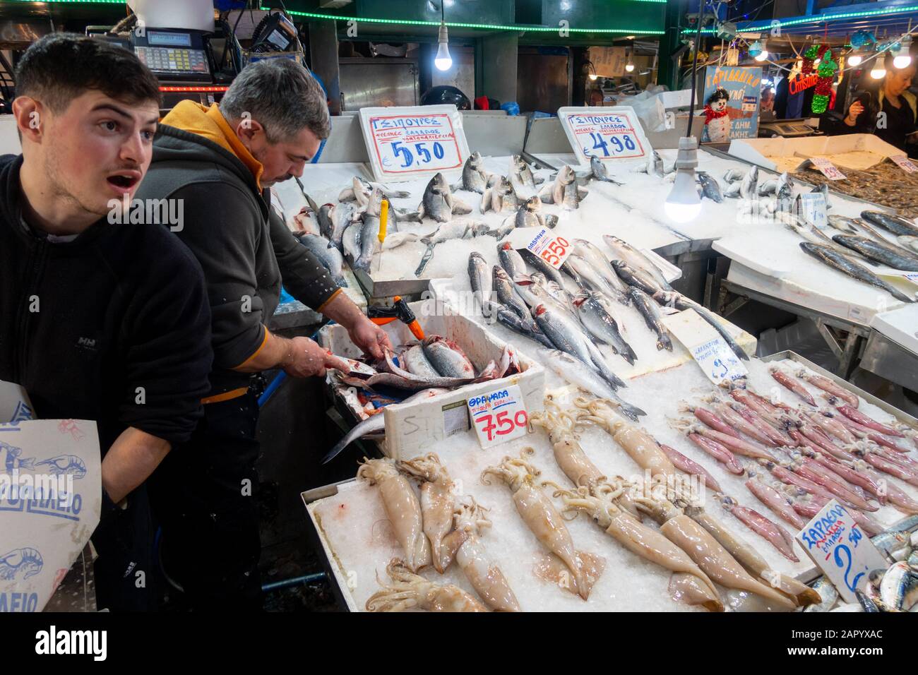 Athens, Greece - Dec 21, 2019: Fishmonger in Central food meat market ...