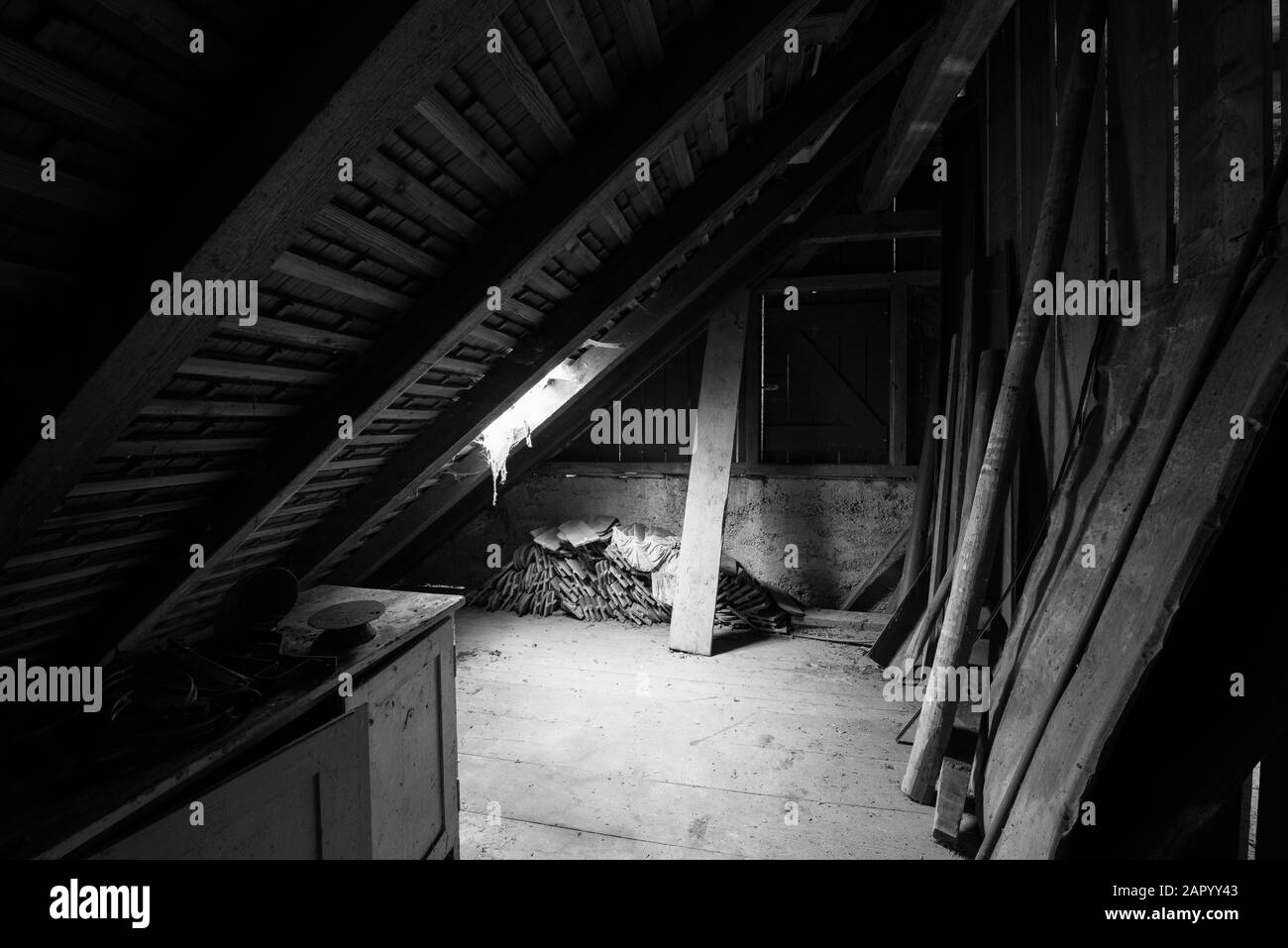 Inside the attic of an old house with cobwebs. black and white Stock ...