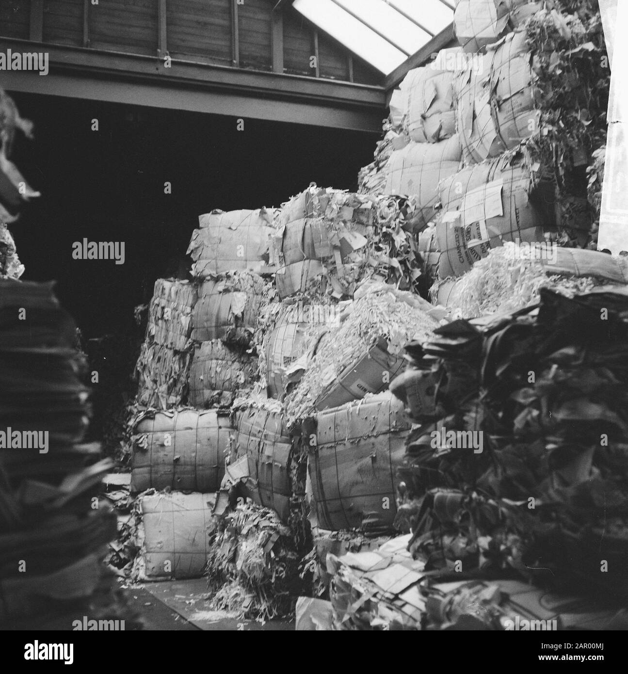 Task Telegraph: Old paper dealer Wessels. Stacked old paper Date ...
