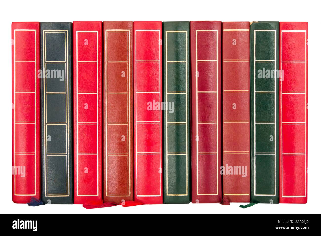 Row of old and worn books with the spines facing forward on an isolated ...