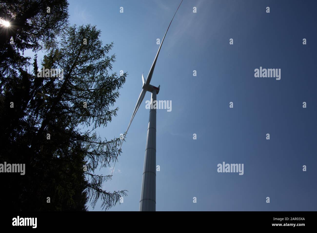 Wind turbine for energy generation in the forest Stock Photo - Alamy