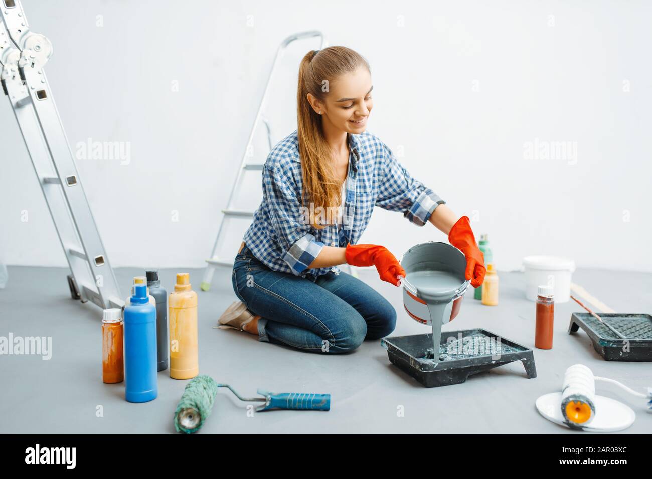 Female house painter prepares for work Stock Photo - Alamy