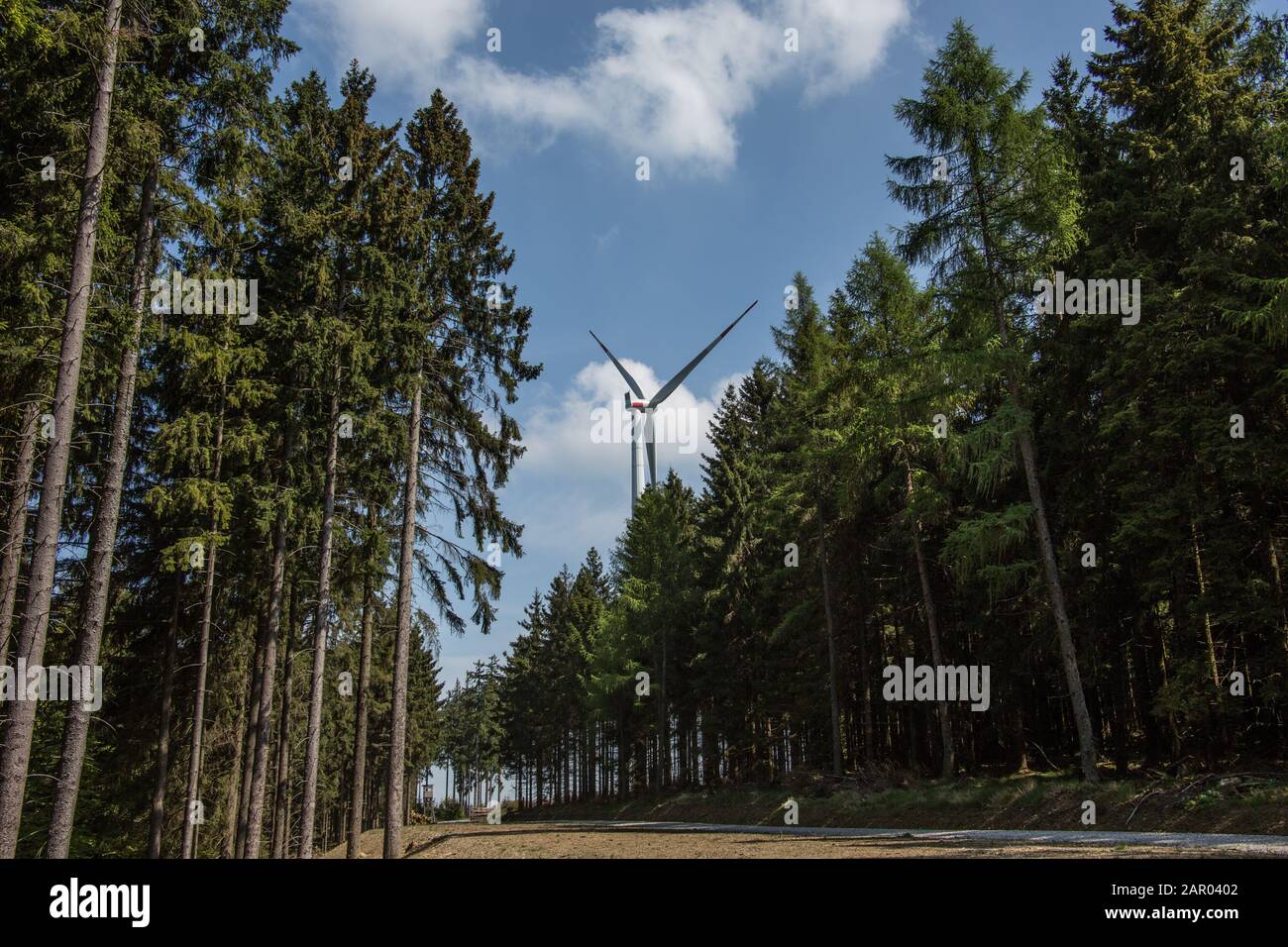 Wind turbine for energy generation in the forest Stock Photo - Alamy