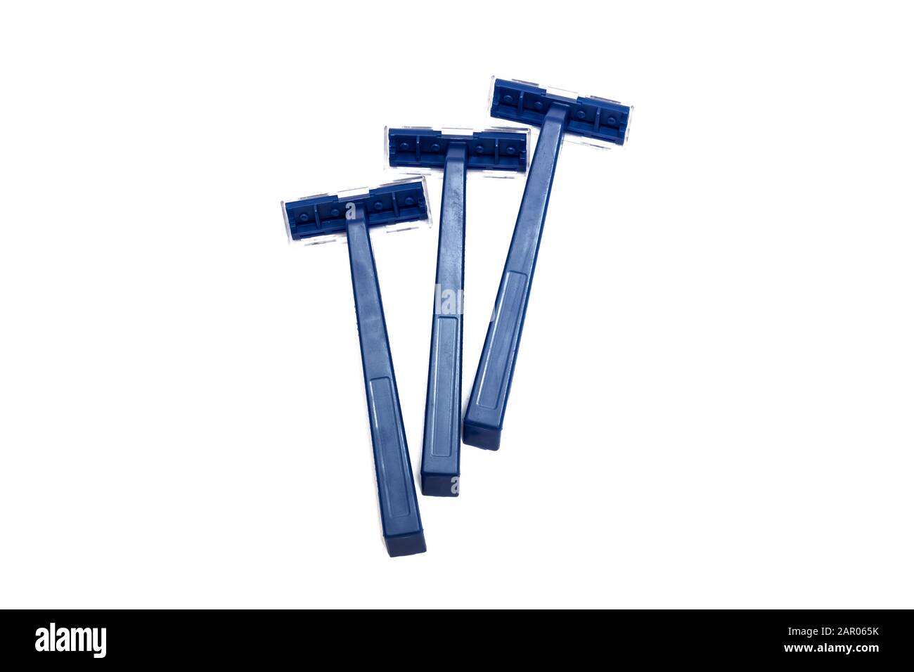 Three blue razors isolated on white background Stock Photo - Alamy