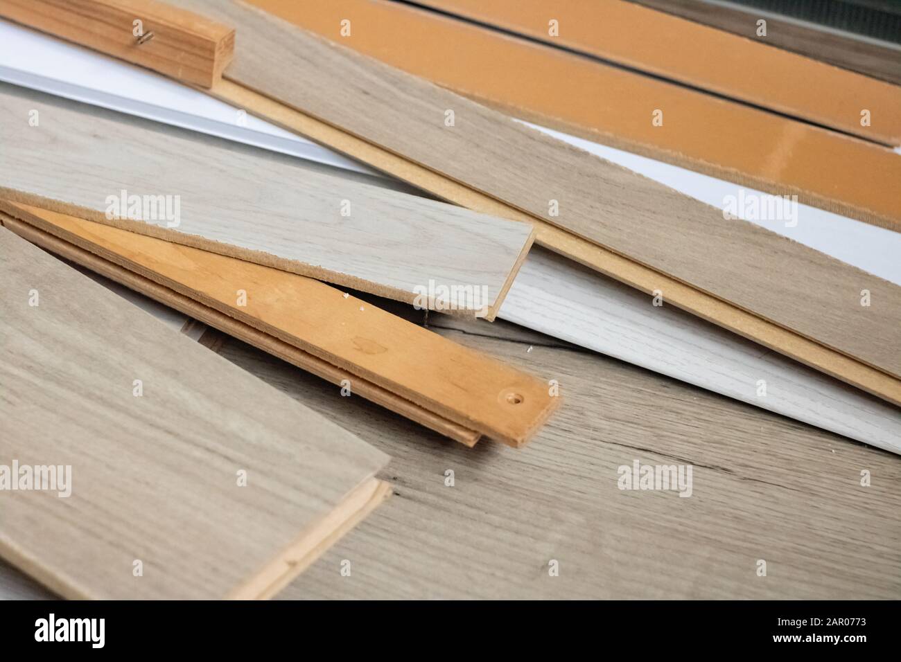 Wooden flooring boards close up, construction waste Stock Photo - Alamy