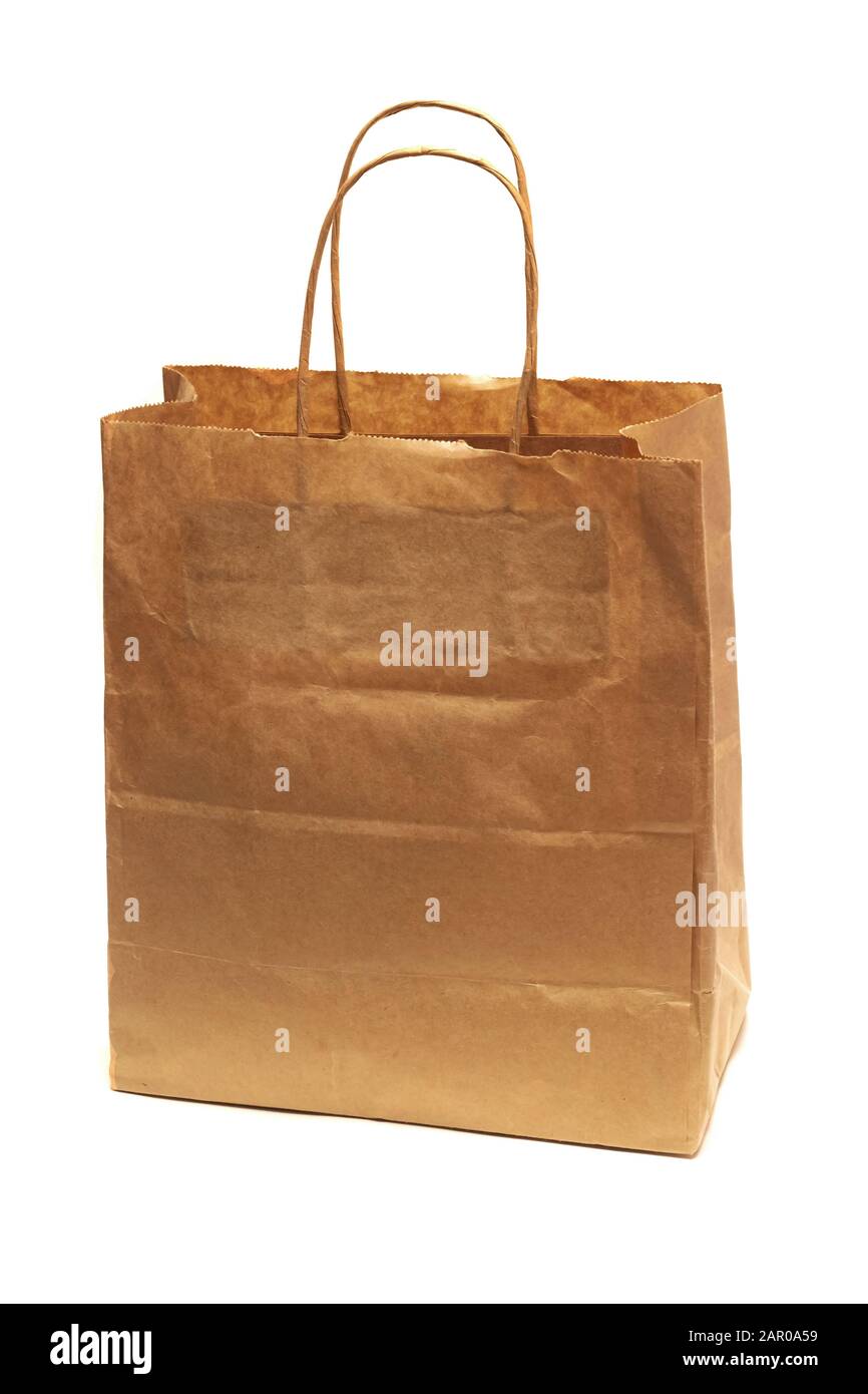 Yellow paper bag isolated on white background Stock Photo - Alamy