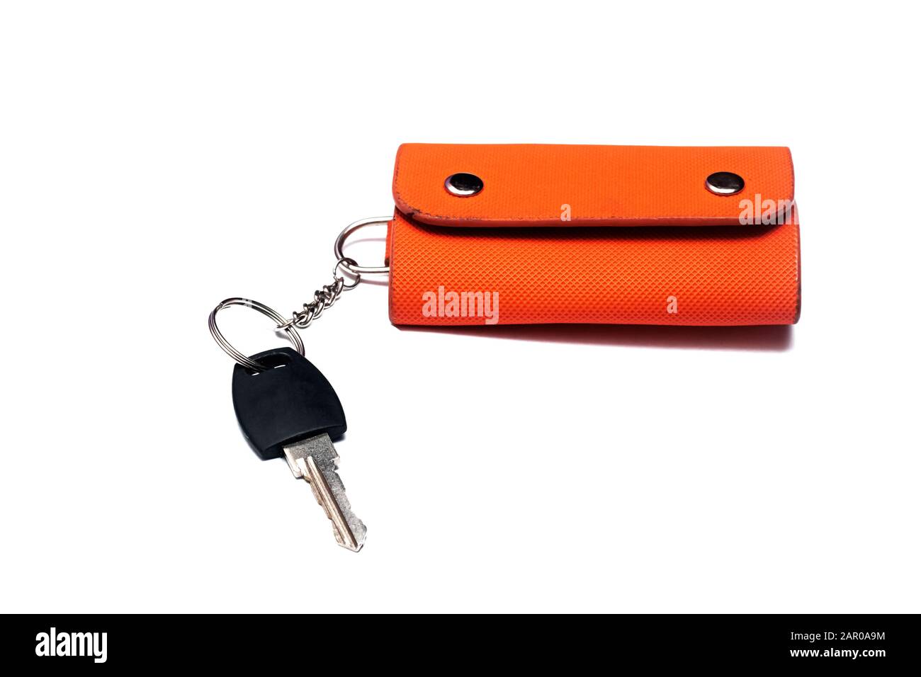 Key and orange case, isolated on white background Stock Photo - Alamy