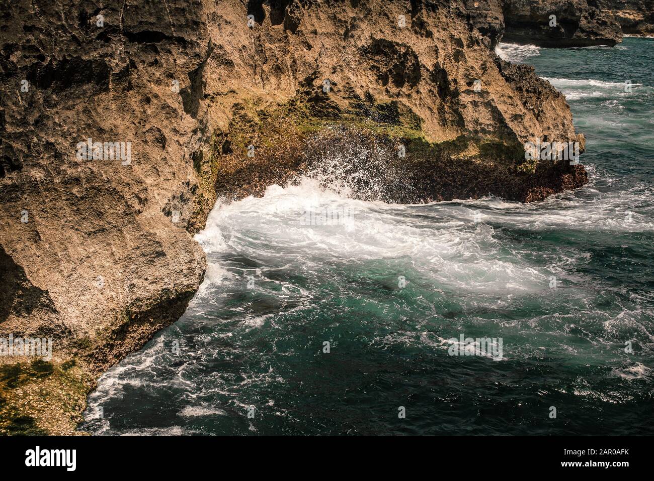 Big wave hitting rocks. Nature find its way Stock Photo - Alamy