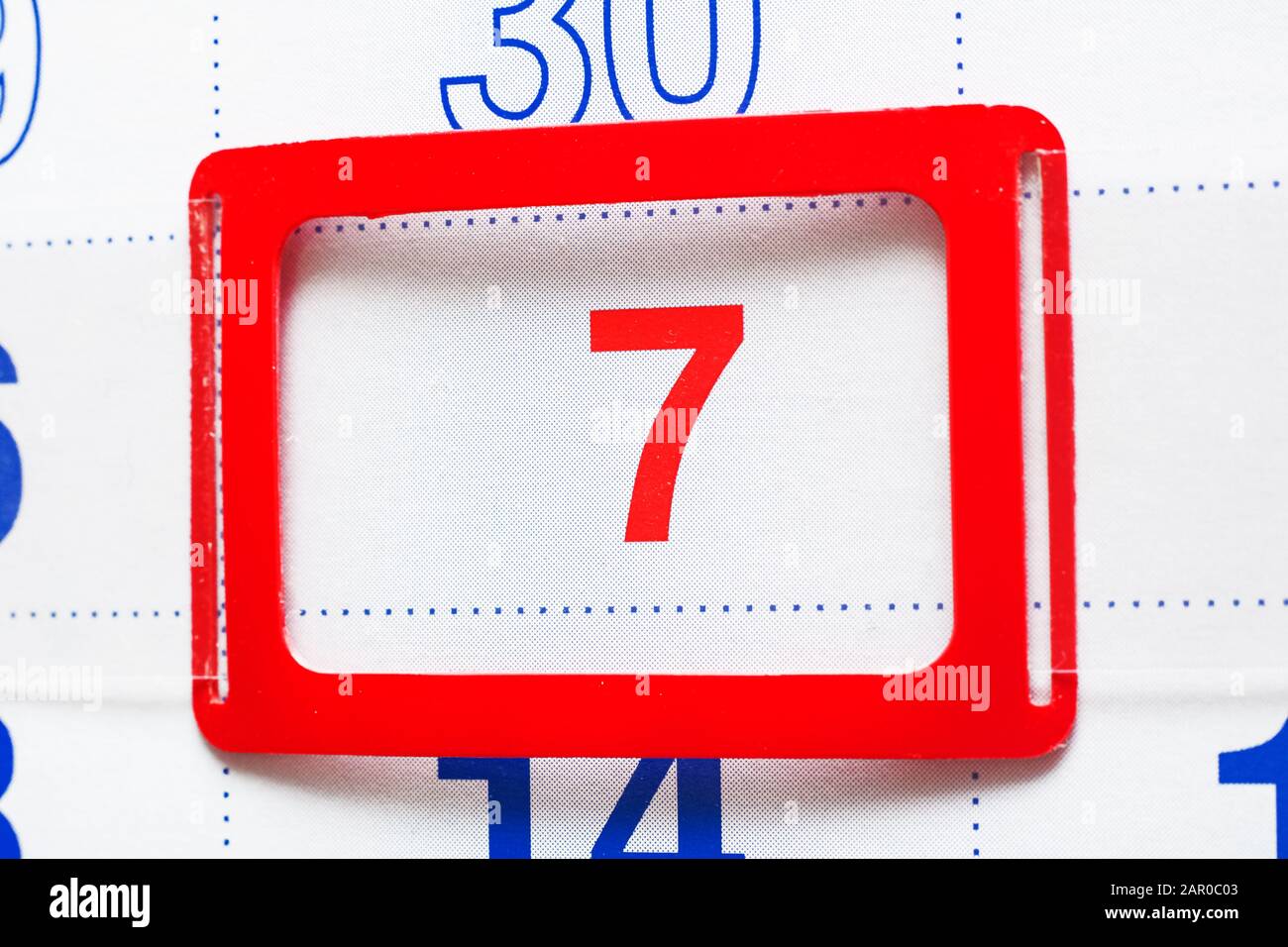 White calendar with a marked date seventh Stock Photo - Alamy