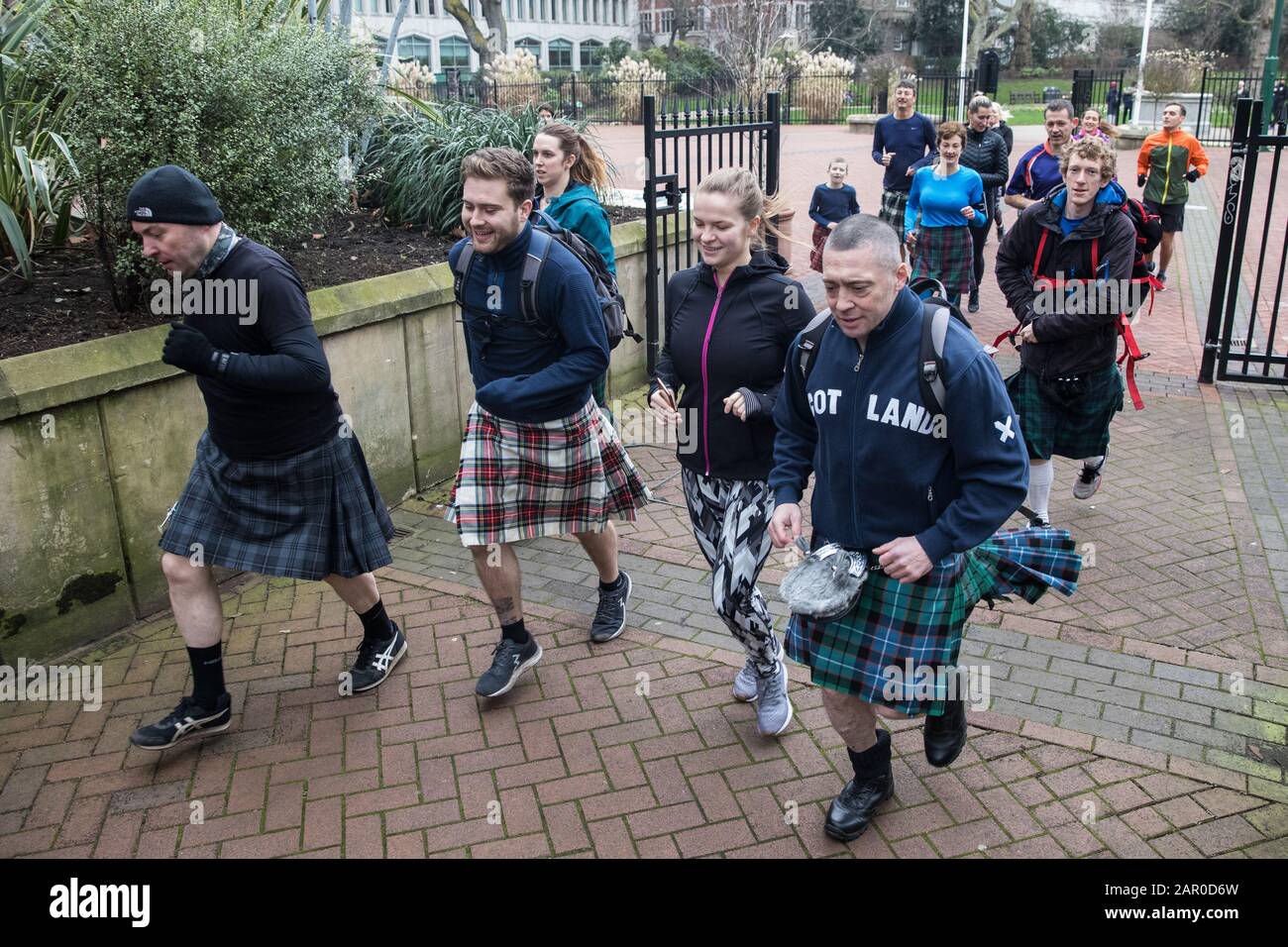 London, UK. 25 January, 2020. Participants wearing kilts take part in ...