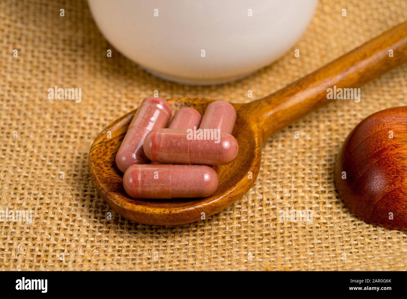 Red yeast rice or angkak or kojic rice capsules Stock Photo - Alamy