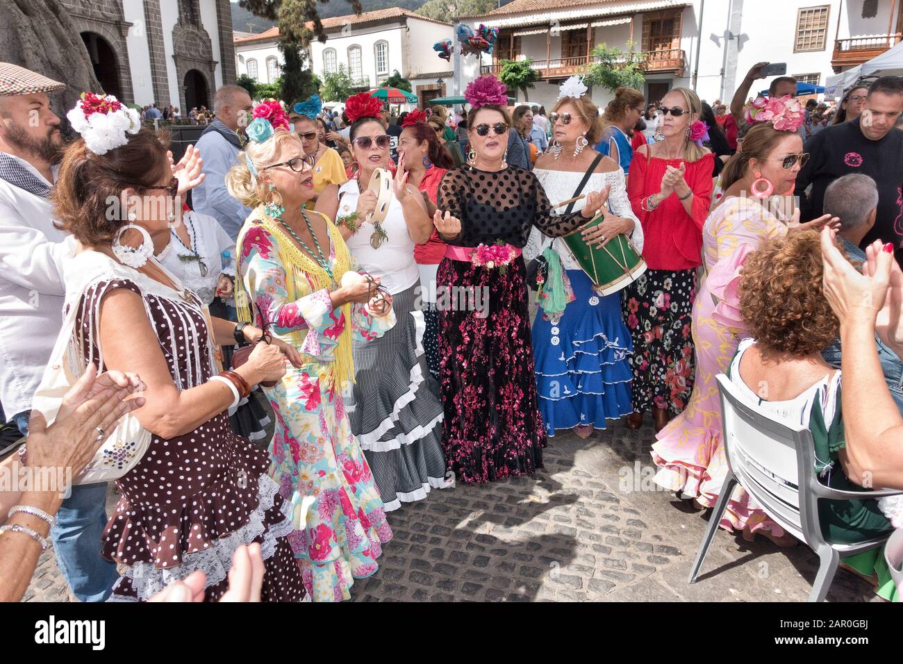 Spanish women with colorful flamenco dresses at the market of Teror ...