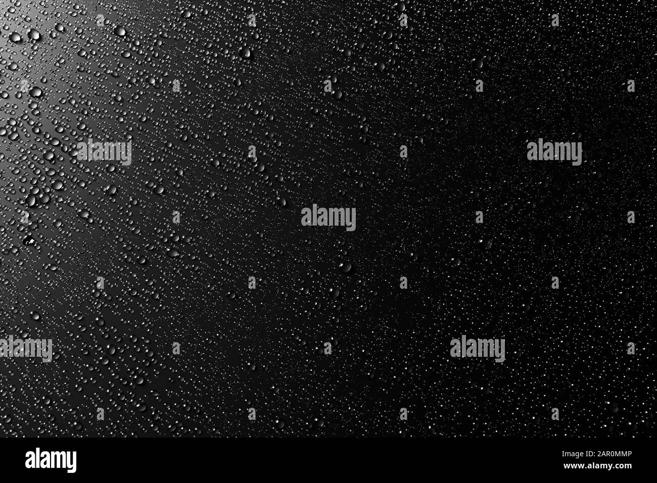 Water droplets on a translucent black glass background with gradient ...