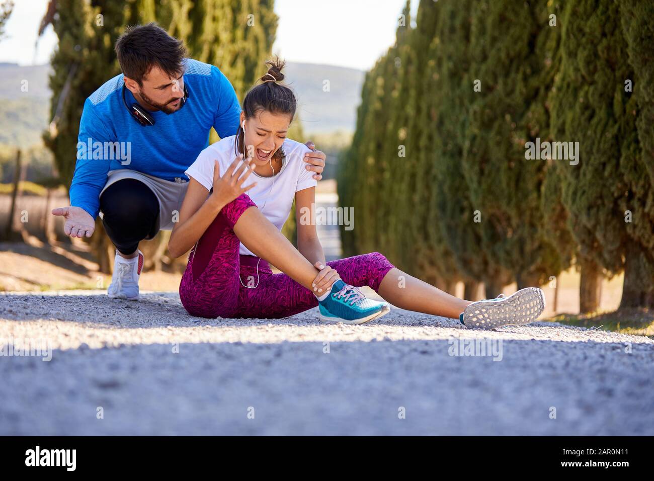 Young woman injured runner athlete foot on jogging Stock Photo - Alamy