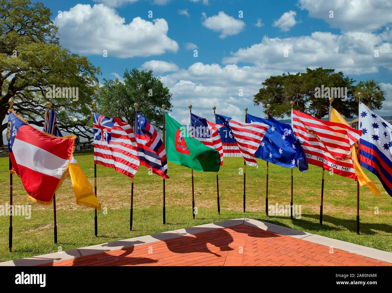 An array of historic early American flags at a public park Stock Photo ...