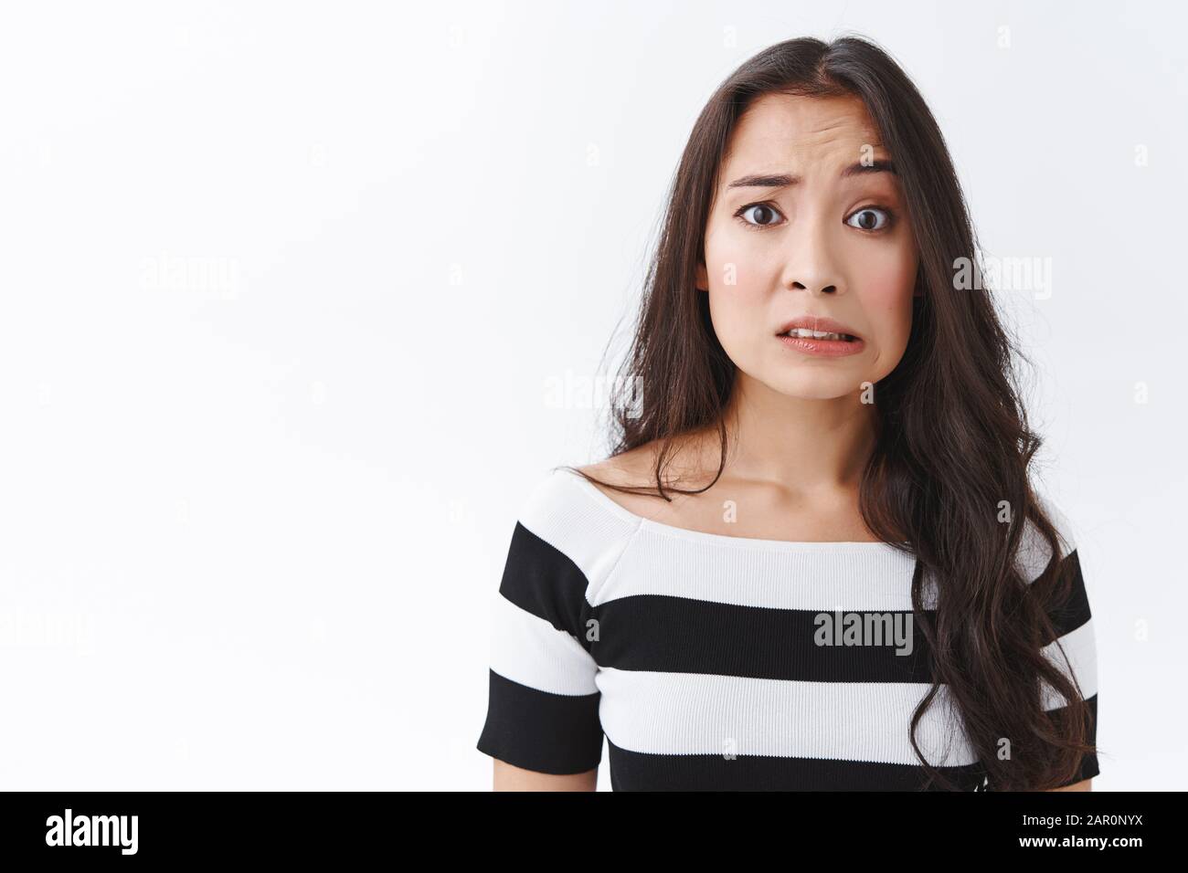 Embarrassed and confused insecure young asian female made mistake, feel ...