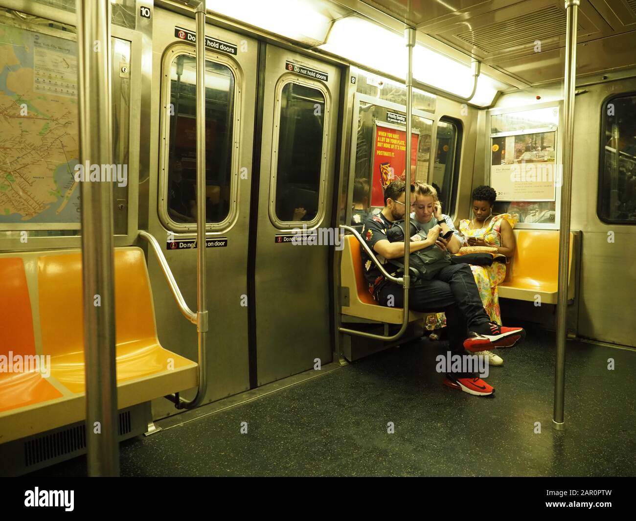 New York, USA - June 2, 2019: 3 passengers in an old subway train in ...