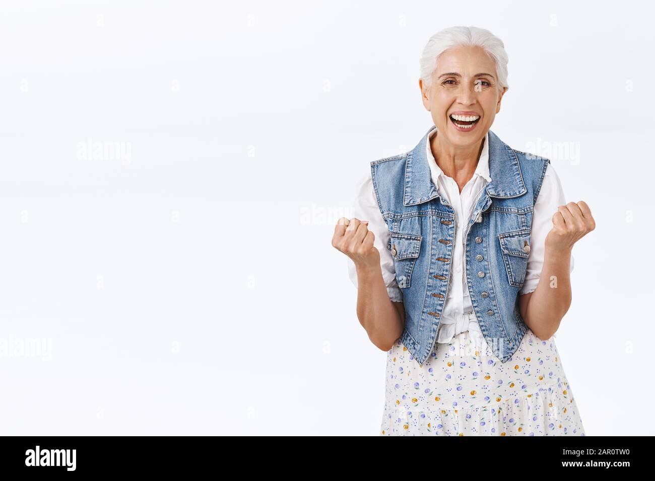 Cheerful, lucky senior woman, granny excited and pleased kid won first ...