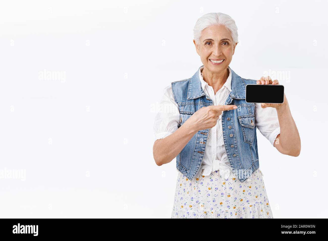 Mature teacher holding smartphone hi-res stock photography and images ...