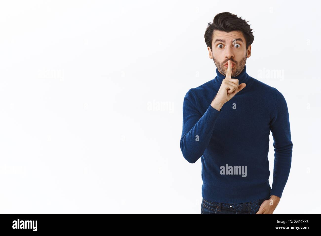 Shush keep quiet please. Nervous handsome male entrepreneur asking stay ...