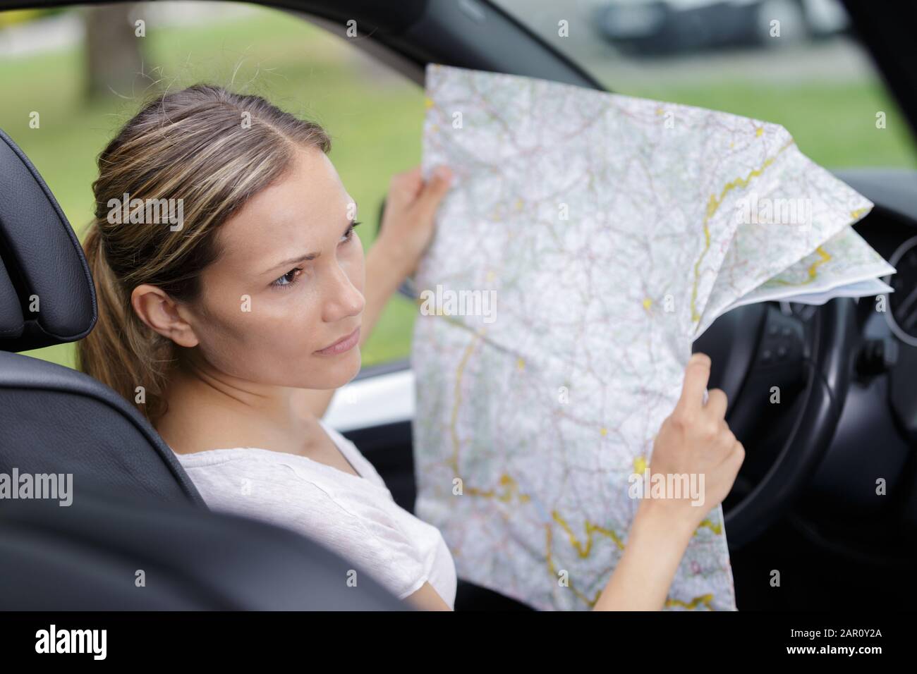 young female asking a road to driver Stock Photo - Alamy