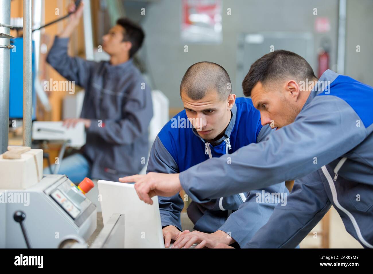 Two machines working together hi-res stock photography and images - Alamy