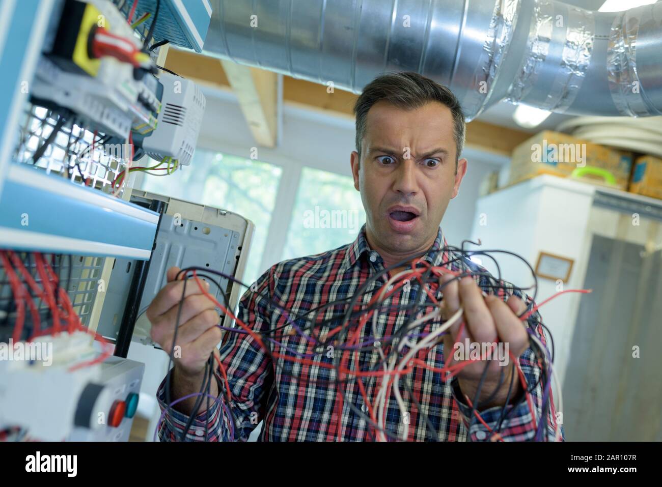 Tangled messy electrical cables in hi-res stock photography and images ...