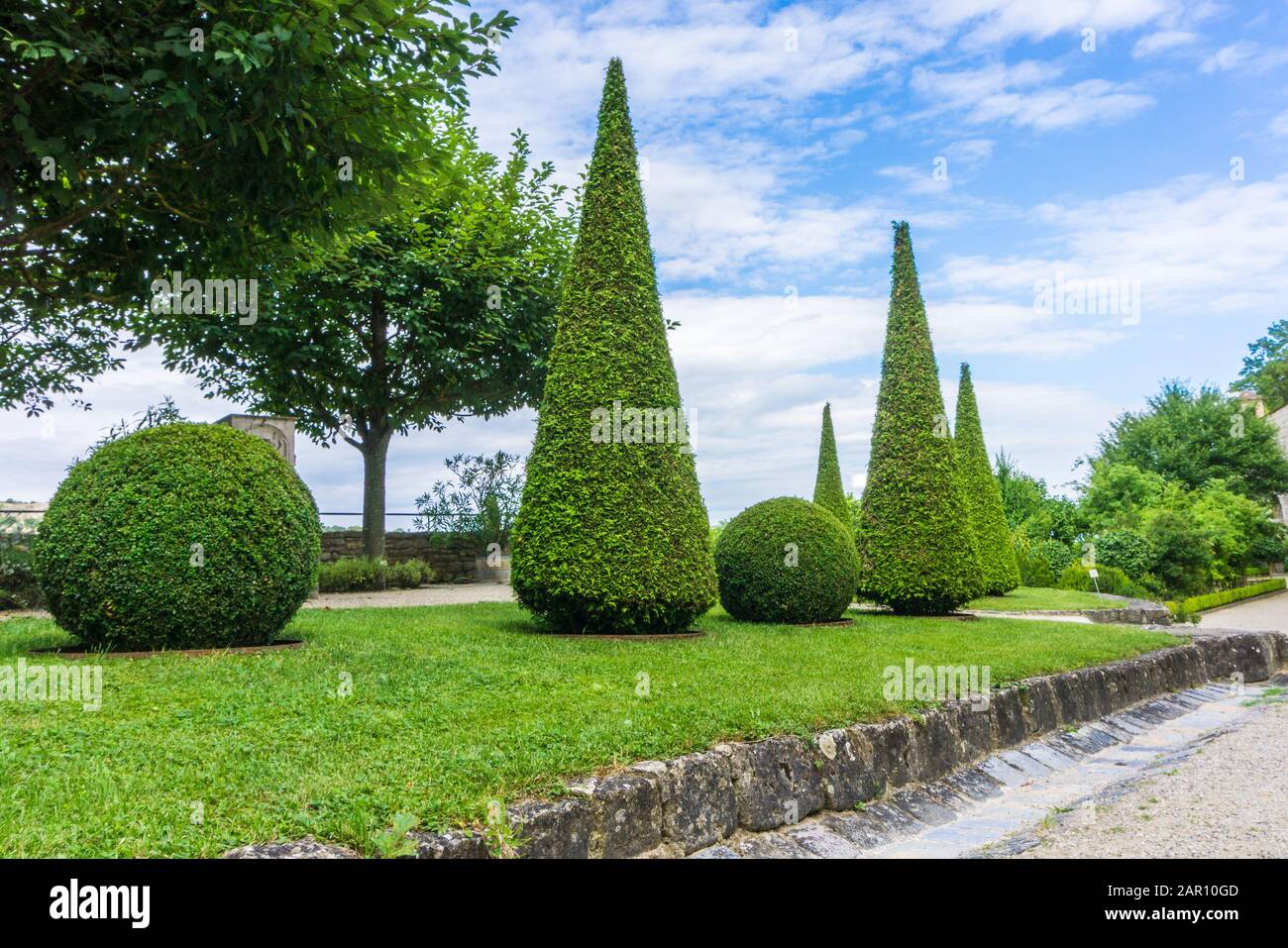 castle ruins and and bux trees in a medieval garden Stock Photo - Alamy