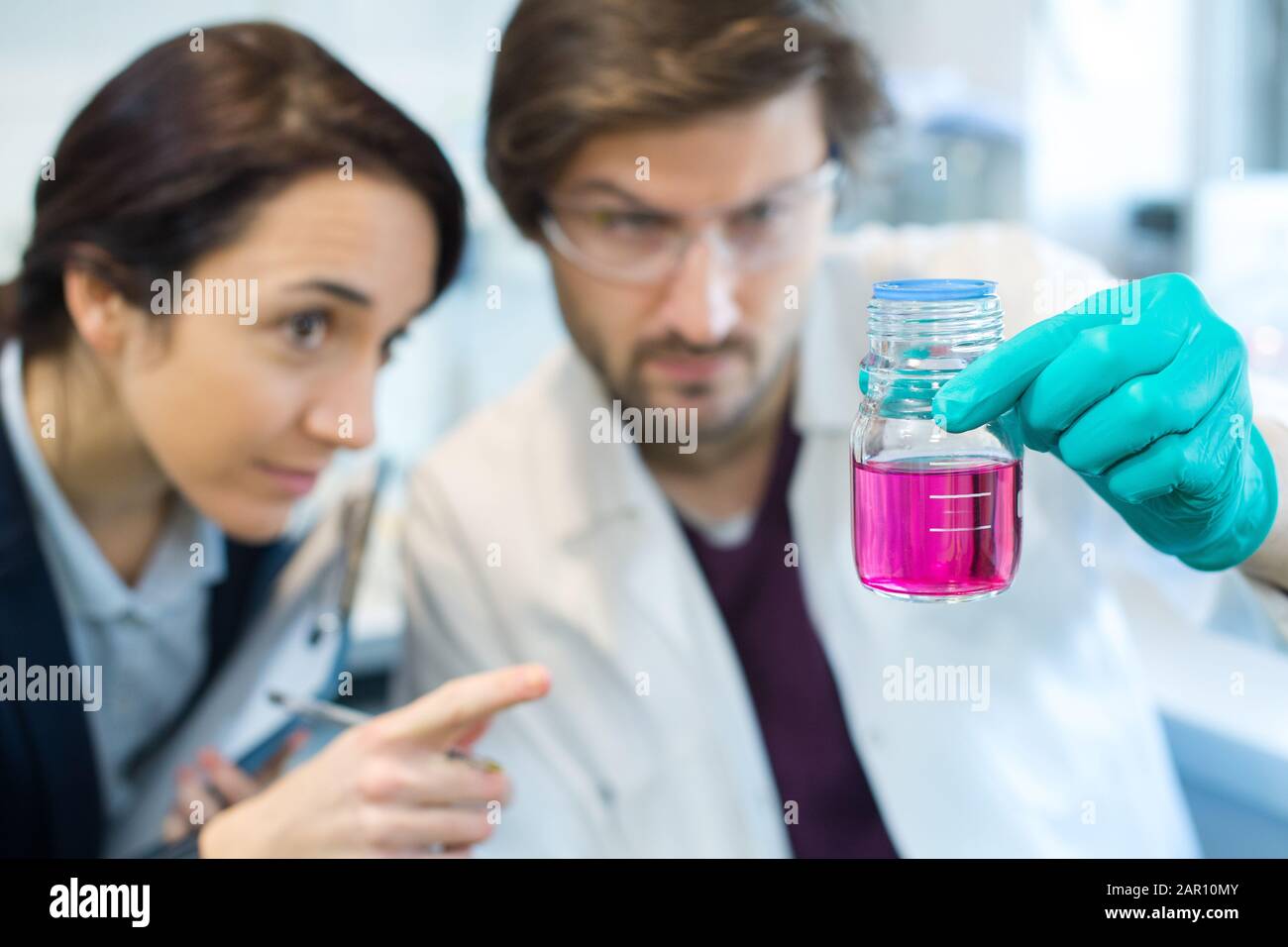 two scientists doing experiments with chemical liquid in the lab Stock ...