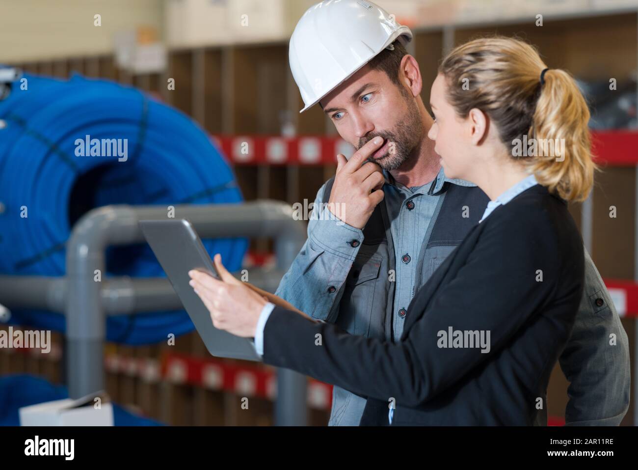 male worker and female boss together in warehouse Stock Photo - Alamy