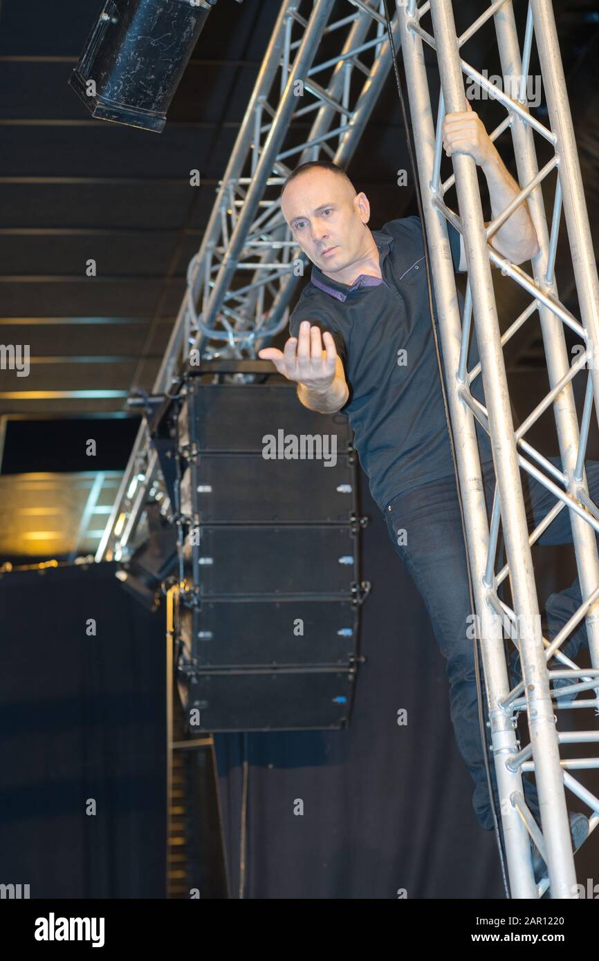 lighting man service control follow light in production house Stock ...