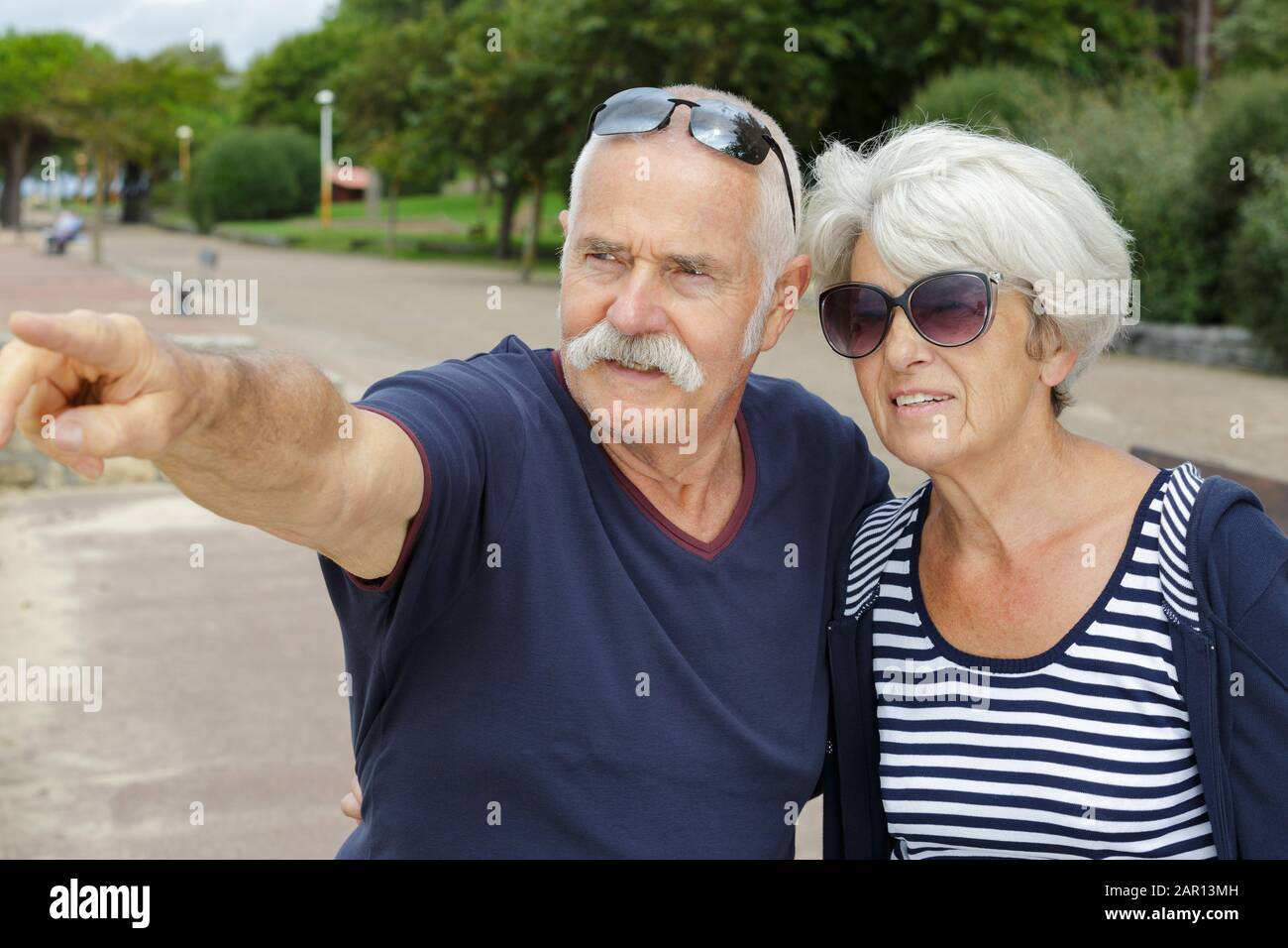 a senior couple pointing something Stock Photo - Alamy