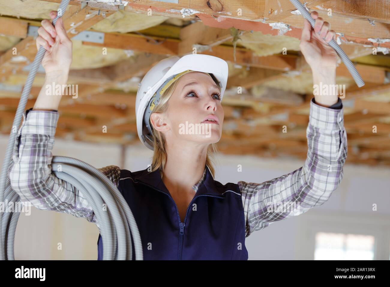 woman connecting network cables to switches Stock Photo - Alamy