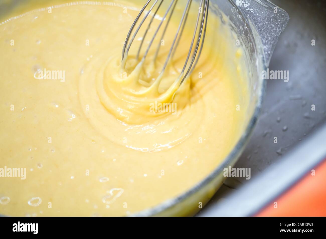 Motion blur photo of mixing homemade delicious cake Stock Photo - Alamy