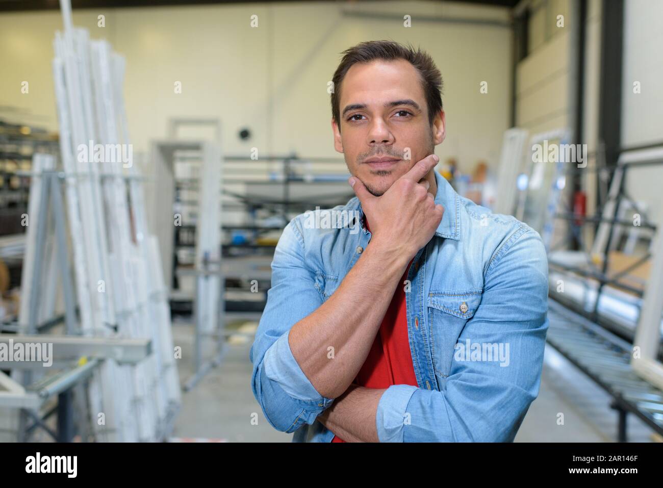 portrait of a young man in factory Stock Photo - Alamy