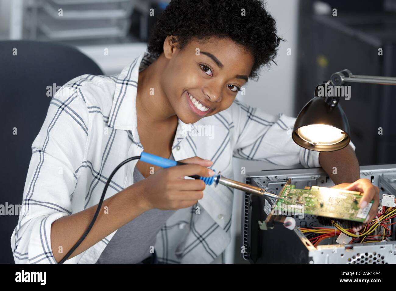 woman soldering pc Stock Photo - Alamy