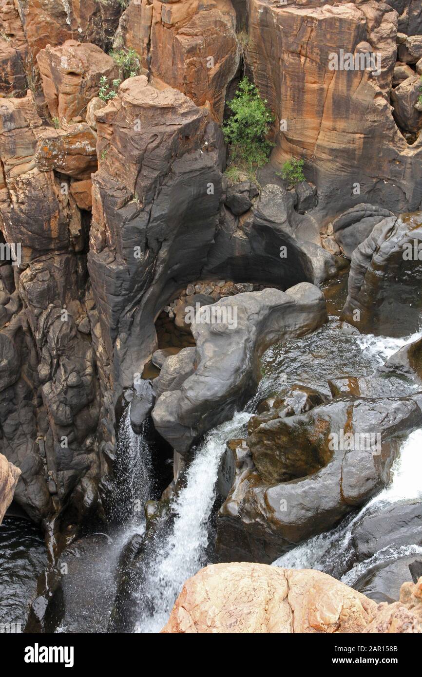 Rocks and waterfall stream at Burke's Luck Potholes, Graskop Blyde ...