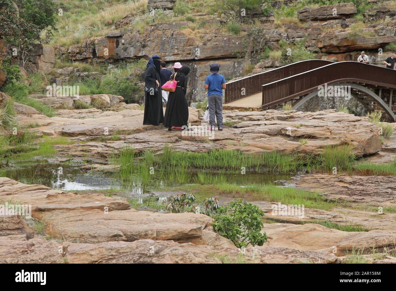 Muslim tourists at steel arching bridge Burke's Luck Potholes, Graskop ...