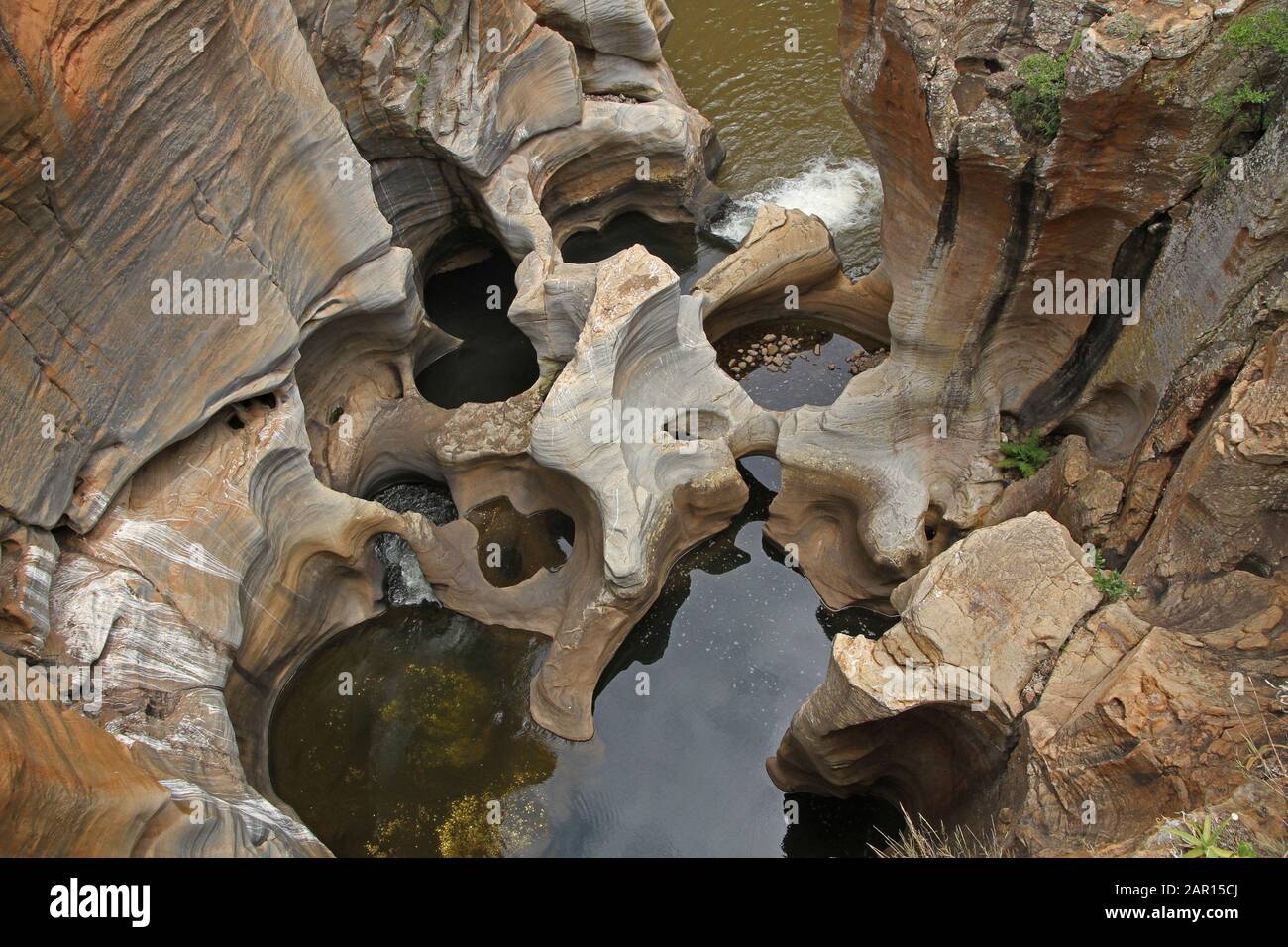 Stream, rock formation and potholes at Burke's Luck Potholes, Graskop ...