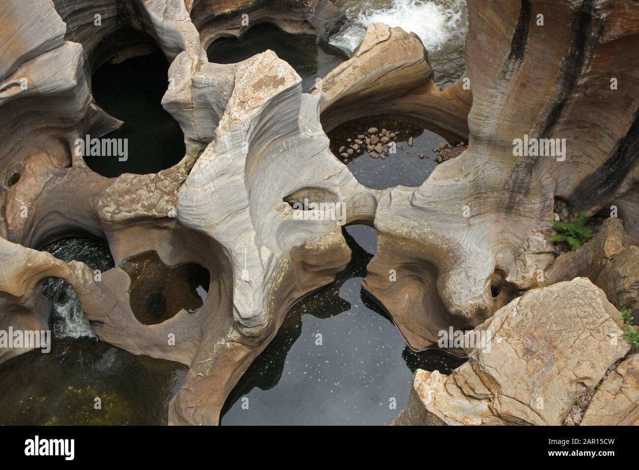 Stream, rock formation and potholes at Burke's Luck Potholes, Graskop ...