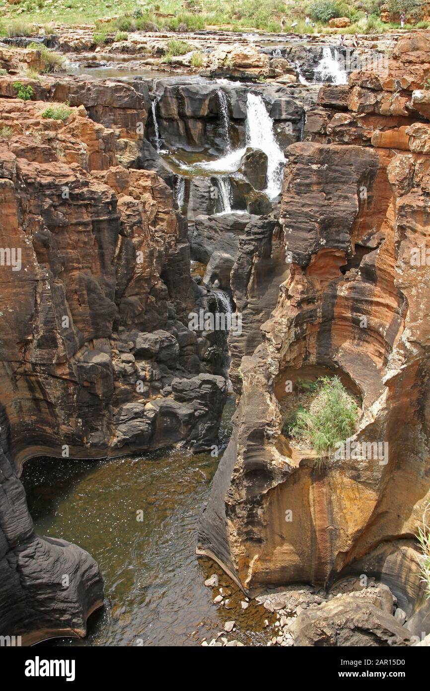 Rocks and waterfall stream at Burke's Luck Potholes, Graskop Blyde ...