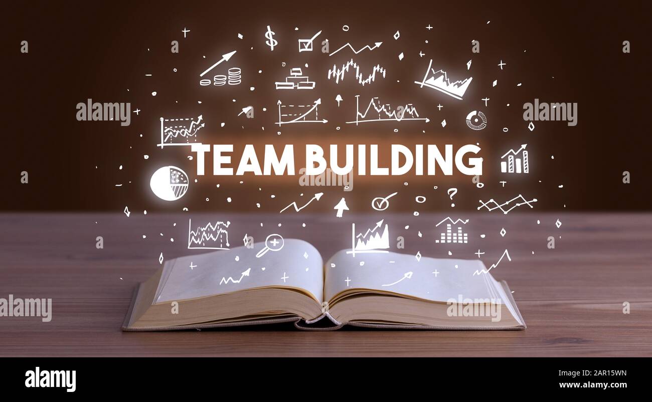 TEAM BUILDING inscription coming out from an open book, business ...
