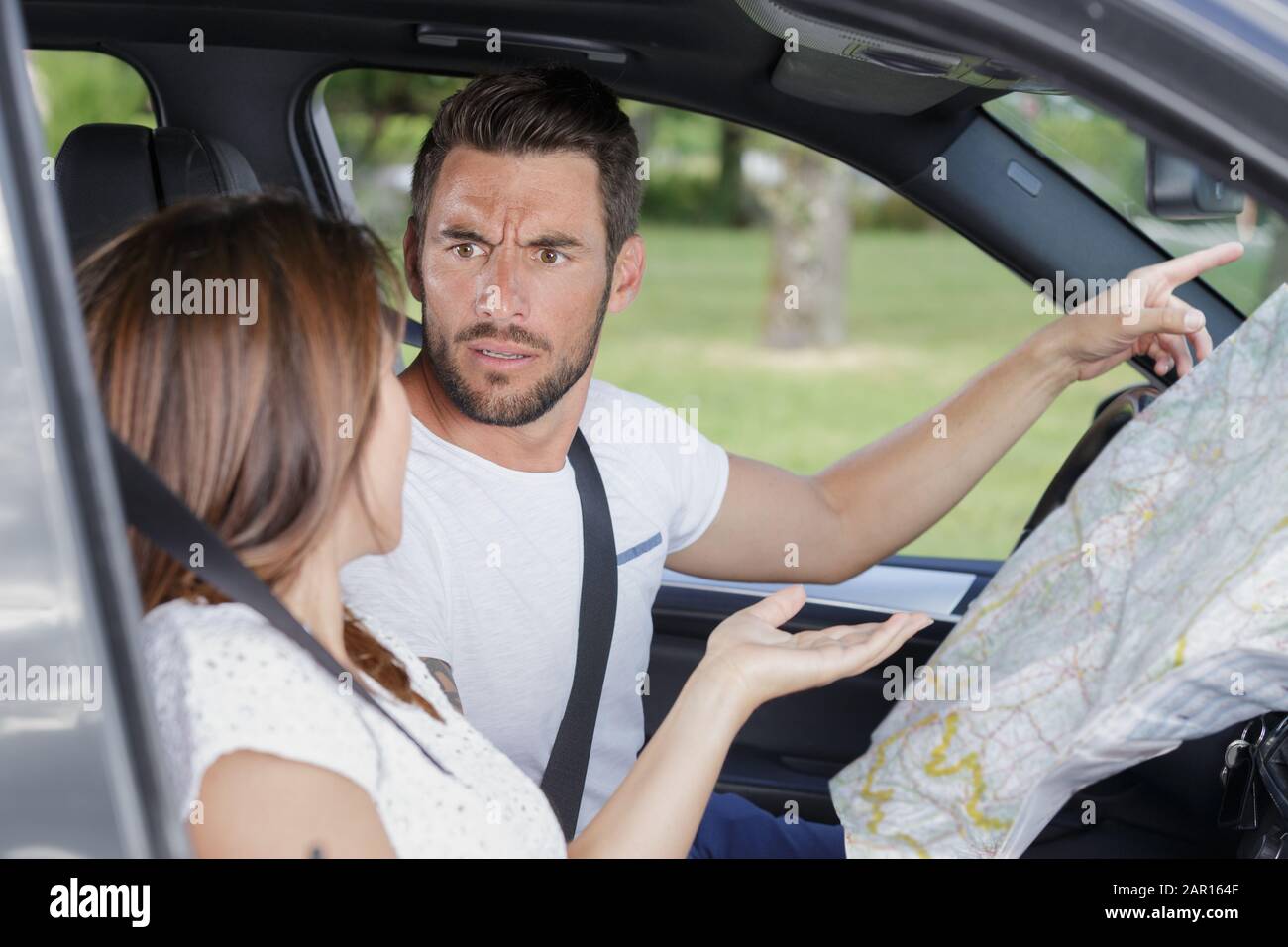 couple in a car arguing about directions Stock Photo - Alamy